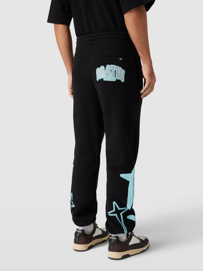 Review X MATW Sweatpants met DGUK-print - MATW x REVIEW in zwart online ...