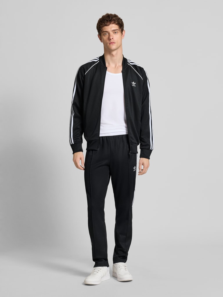 adidas Originals Trainingshose mit Längsnähten und elastischem Bund ...