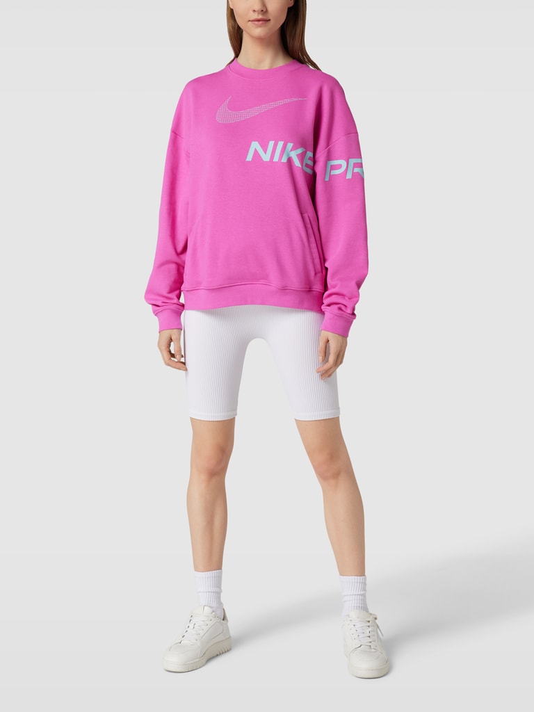 Nike Training Sweatshirt mit seitlichen Eingrifftaschen (pink) online ...